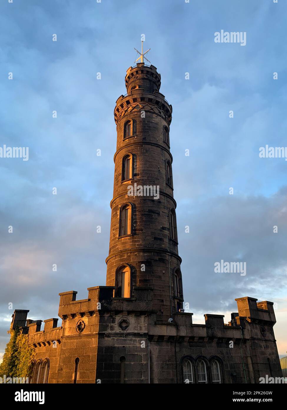 Nelson monument tower at sunset on Calton hill in Edinburgh, Scotland ...
