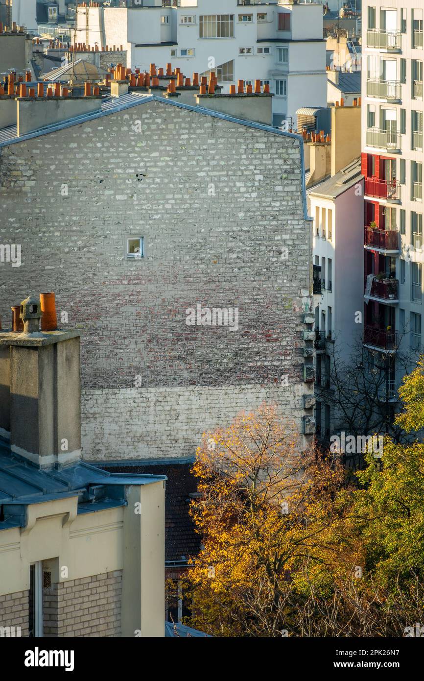 Aerial view of Paris, France with a blank gable brick wall with copy ...