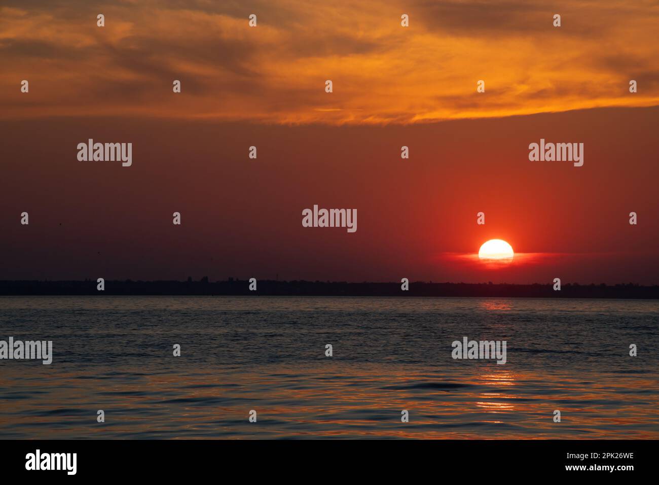 Beautiful red and orang sunset over the lake Stock Photo - Alamy