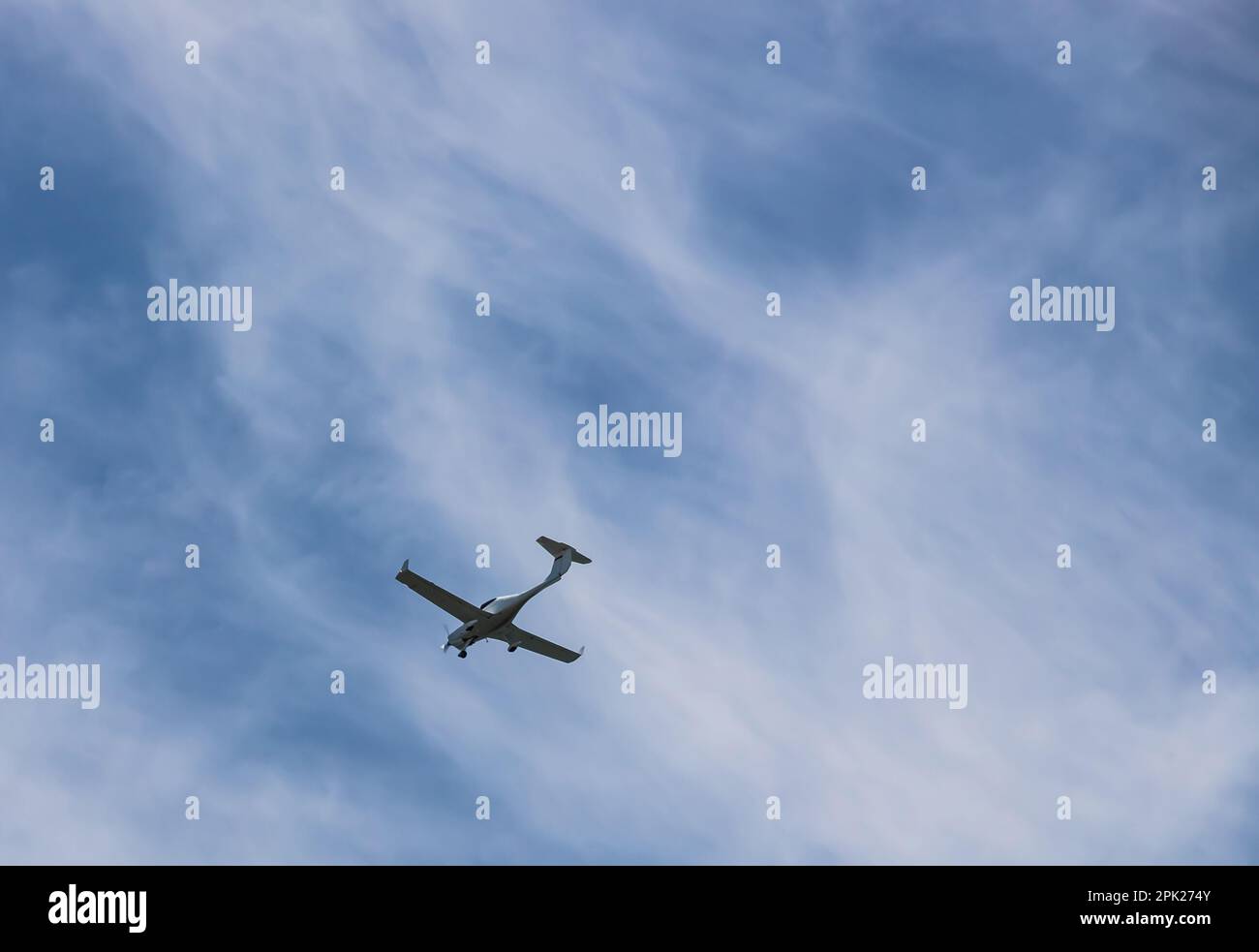 small plane flying low in the sky with space for text Stock Photo - Alamy