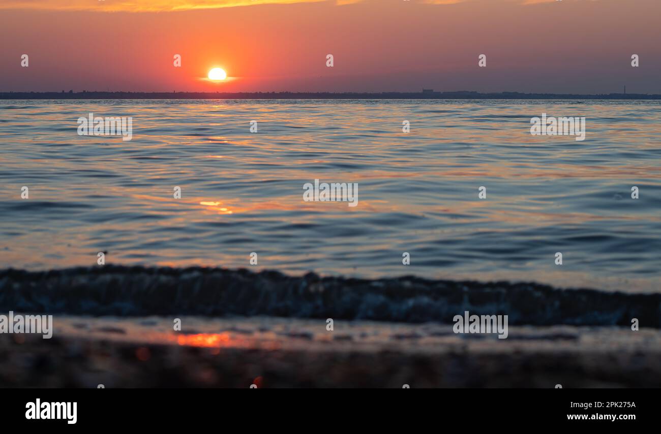 Beautiful red and orang sunset over the lake Stock Photo - Alamy