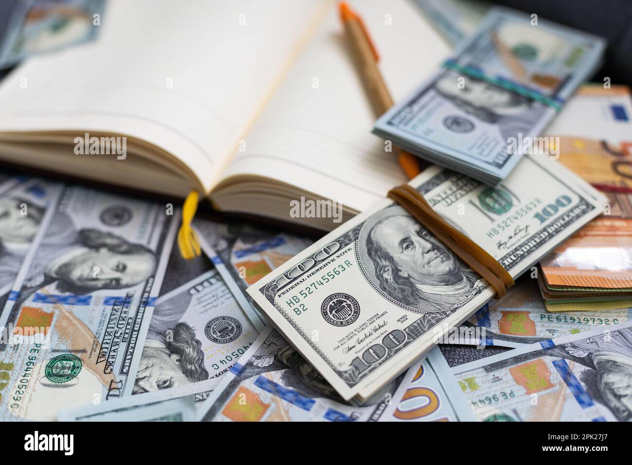 Notebook with vintage fountain pen and euro banknotes between the pages ...