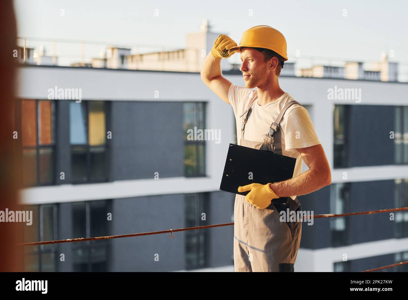 Project manager. Young man working in uniform at construction at ...