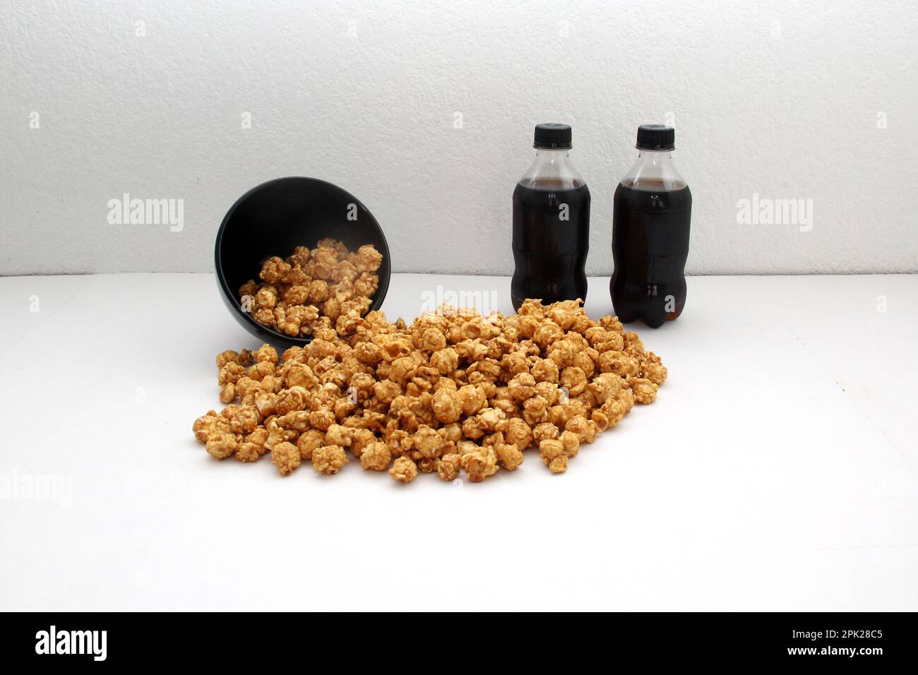 Caramel popcorn with cola in a container ready for a party or movie ...