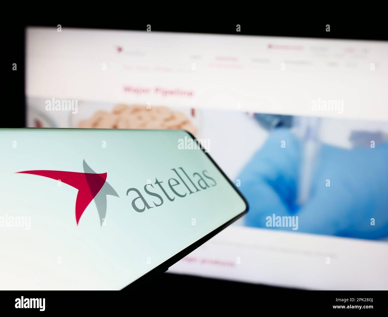Mobile phone with logo of pharmaceutical company Astellas Pharma Inc ...