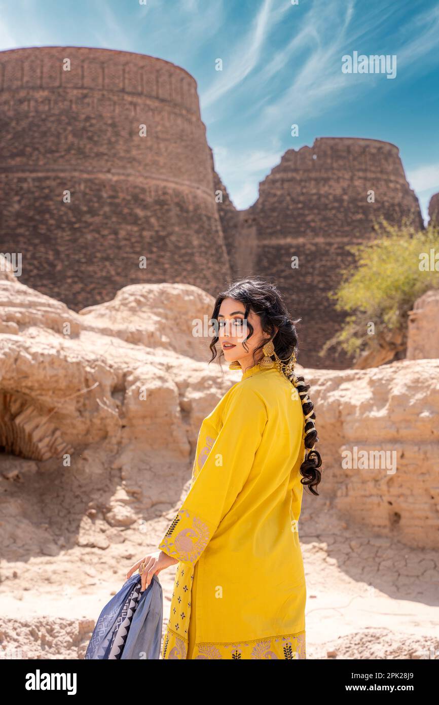 A photo of a model in historical place wearing yellow dress Stock Photo ...