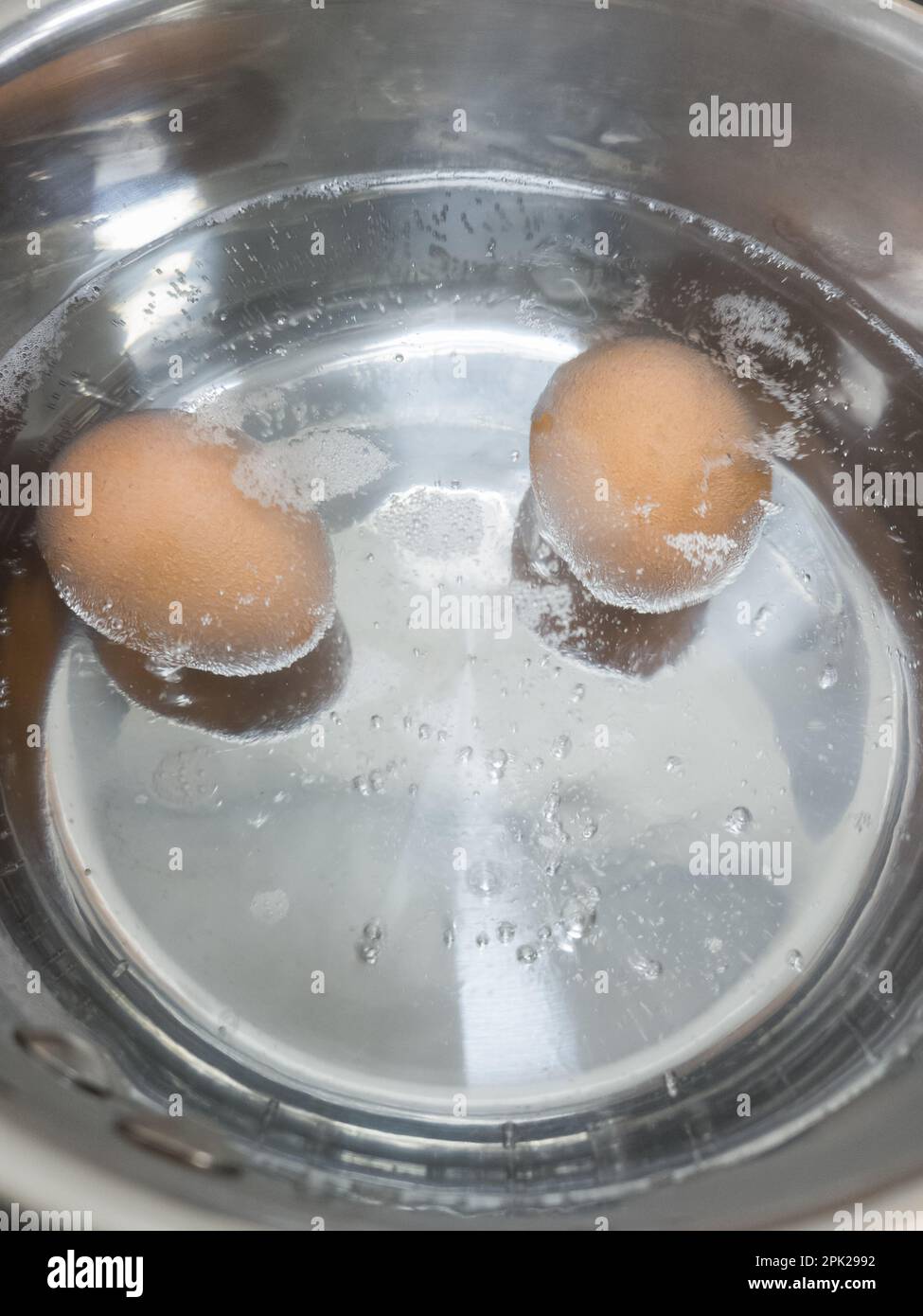 Chicken eggs boil in saucepan hi-res stock photography and images - Alamy