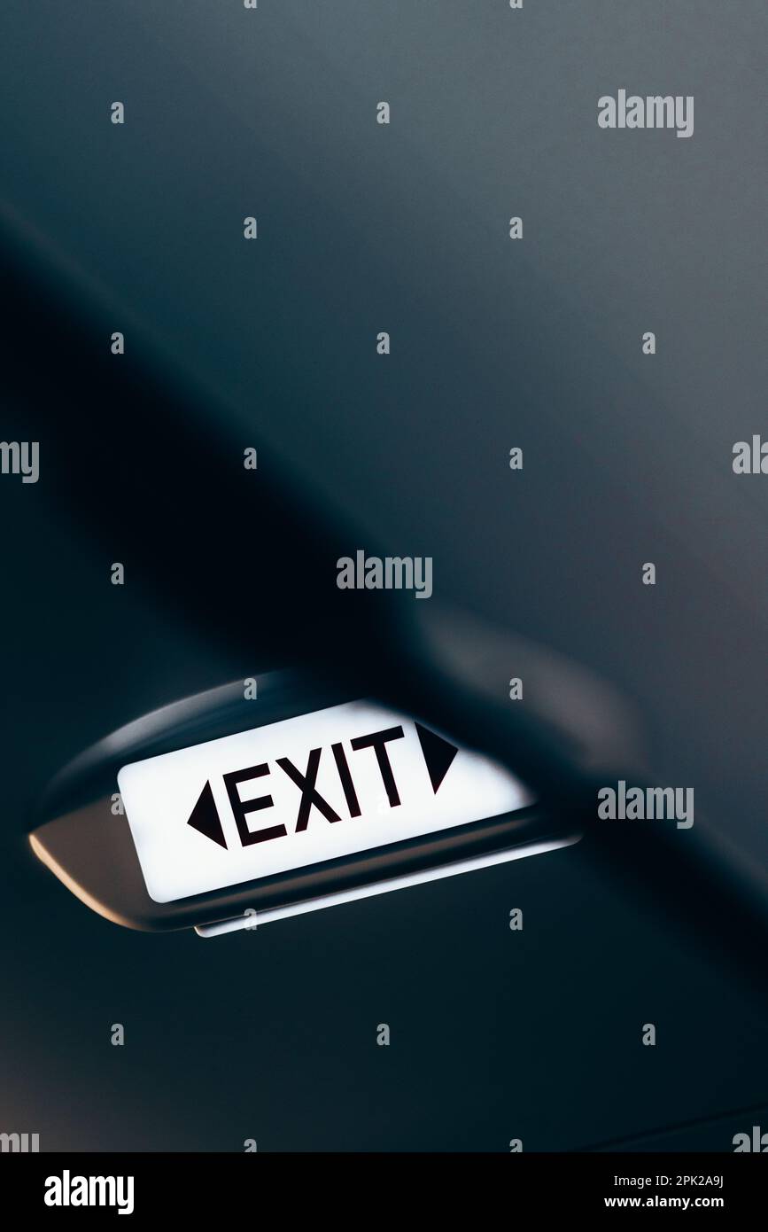 Close up of exit sign in passenger airplane Stock Photo - Alamy