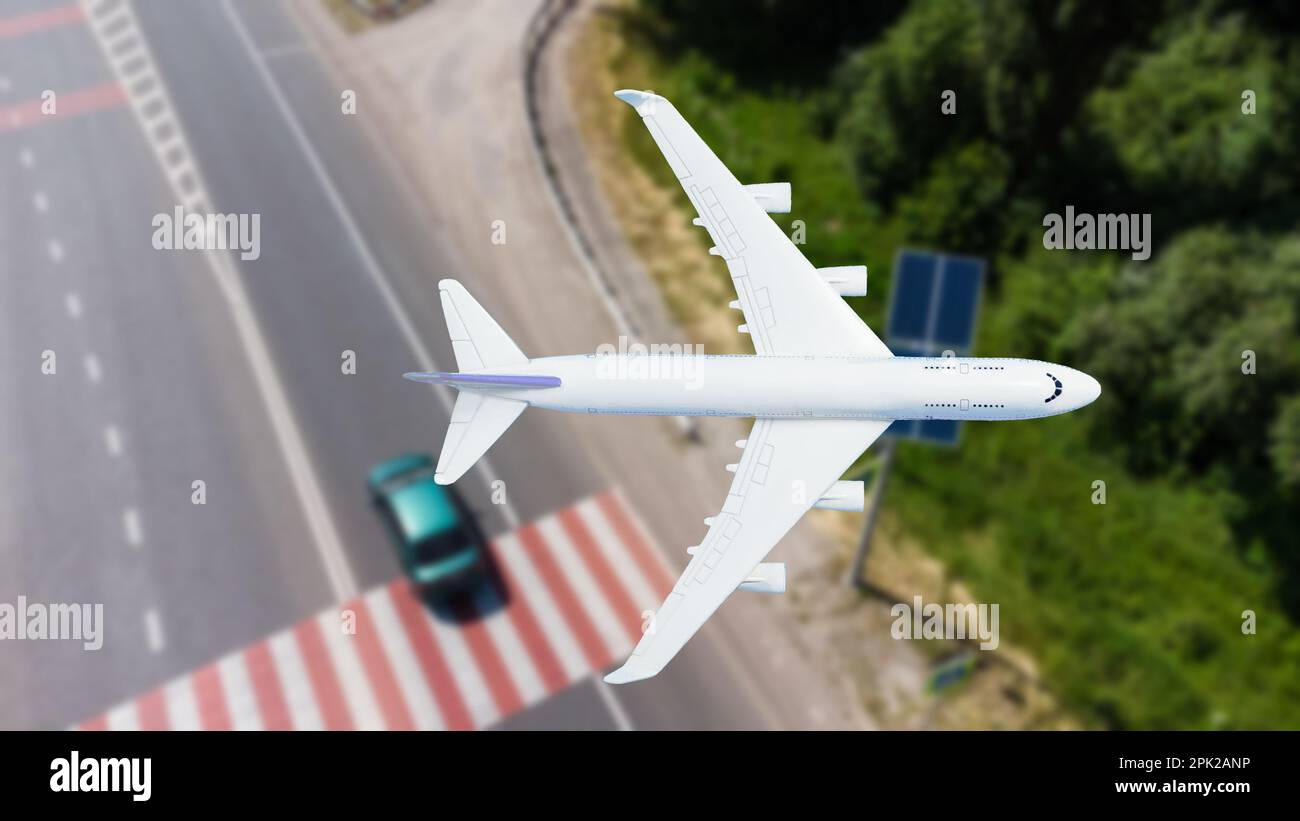 plane flies above the landscape. Side view of aircraft. Travel and ...