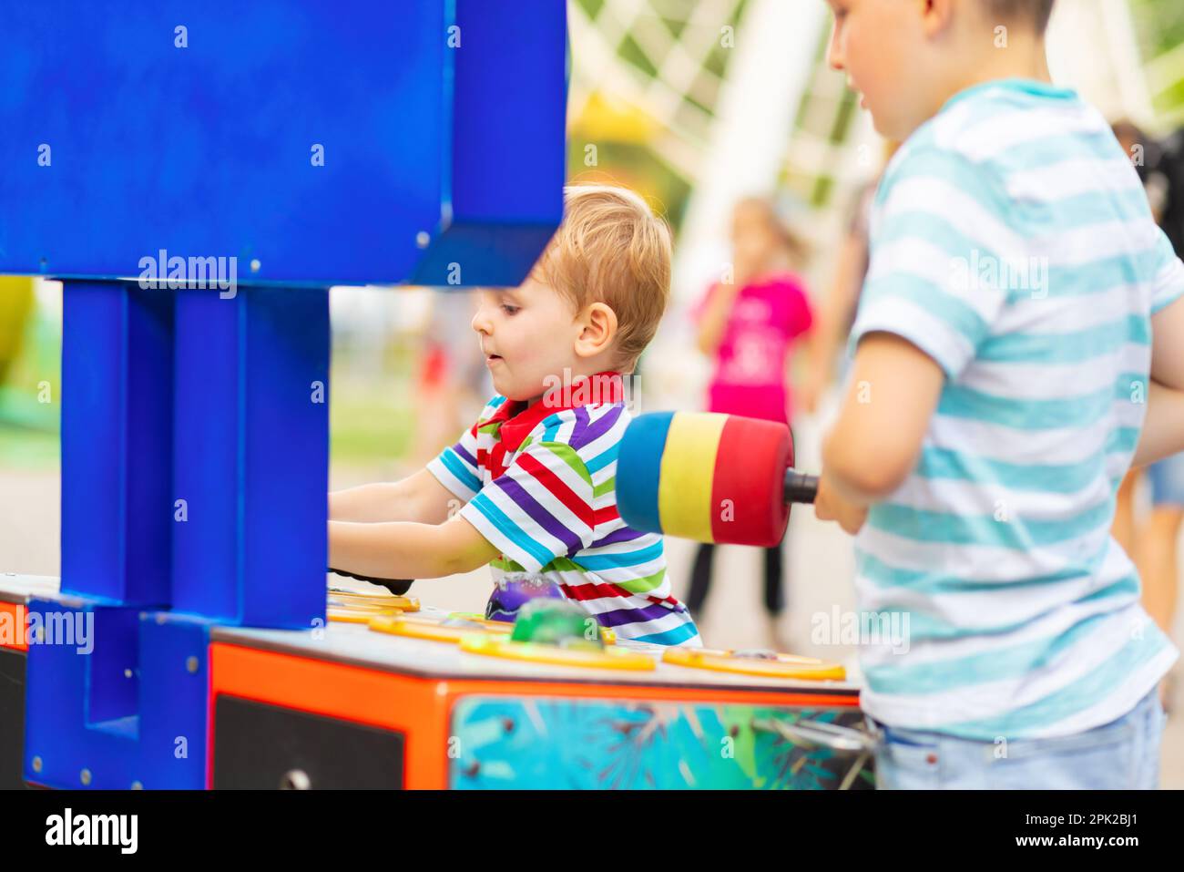Boy playing whack a mole at a carnival hi-res stock photography and ...