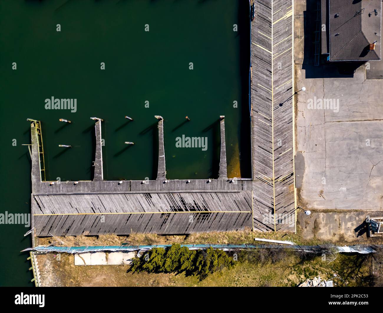 Aerial view of a boat dock situated beside a coastal area near a ...