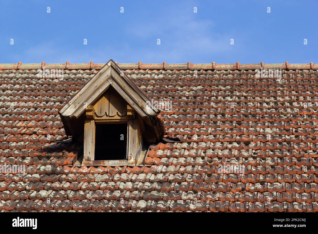 Old house with tile roof on the background of the sky. Texture, roof ...