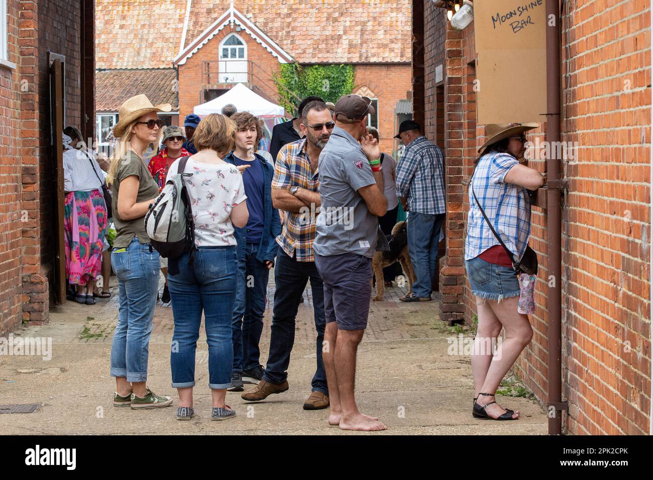 People queuing for a hole in the wall Moonshine Bar at the 2017 ...