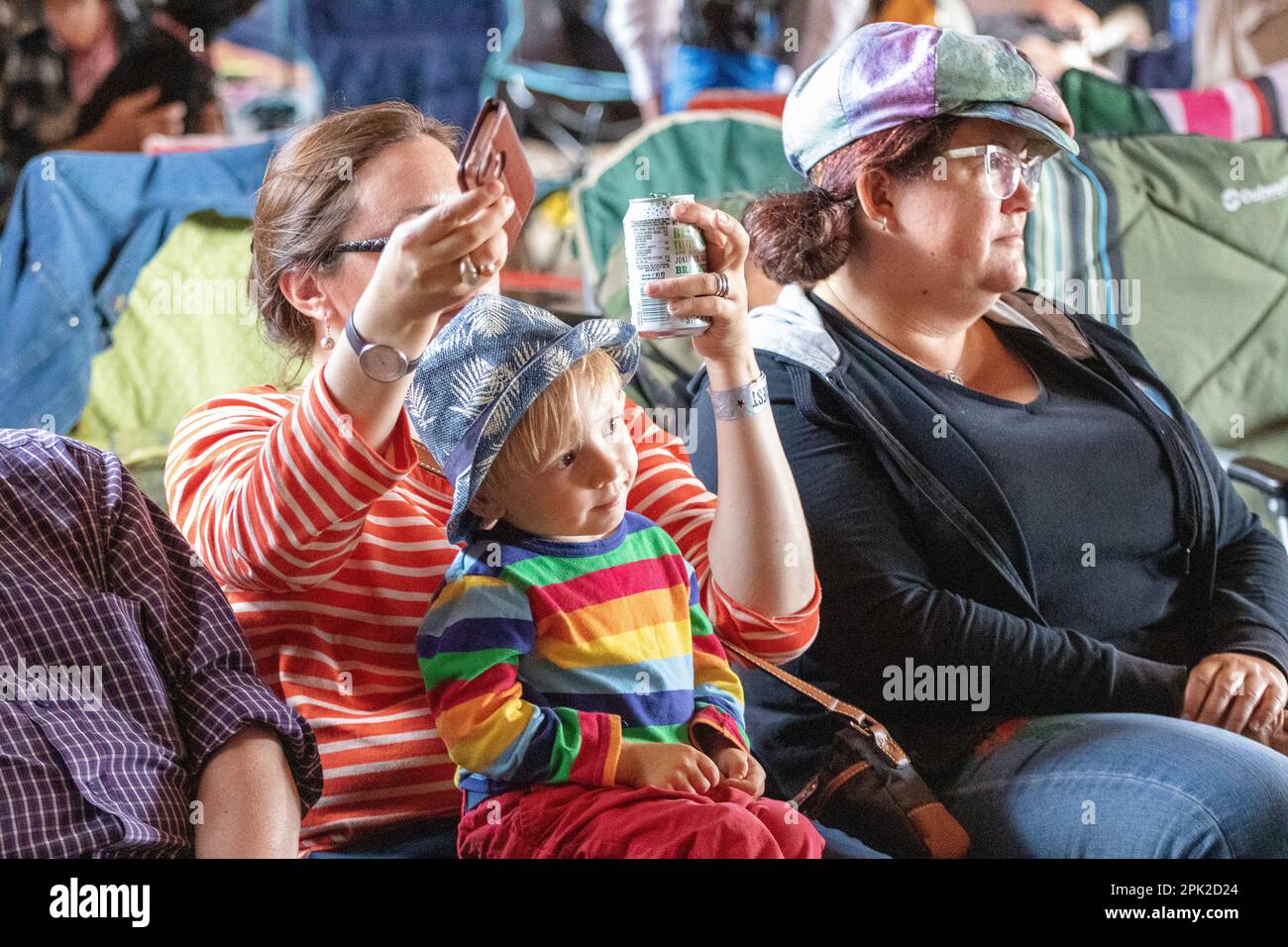 Child holding seated sitting hi-res stock photography and images - Alamy