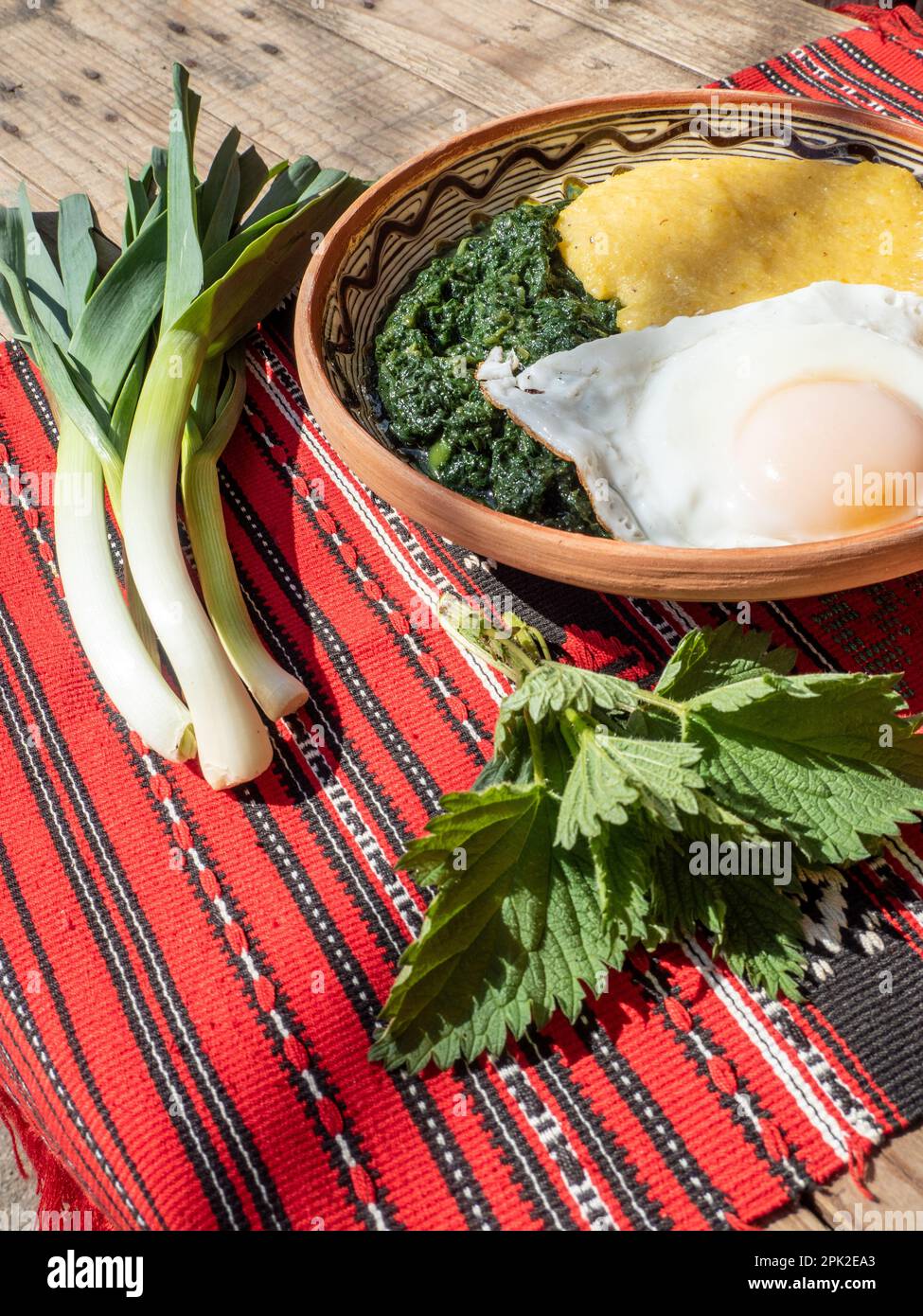 vegetarian food with nettle herb and fresh garlic and polenta Stock ...