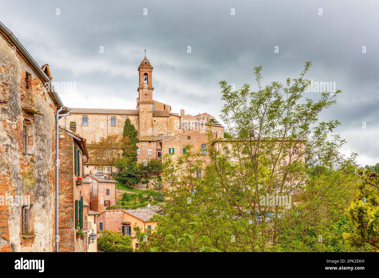 Old Italian rural village on a hill with dark rain clouds Stock Photo ...