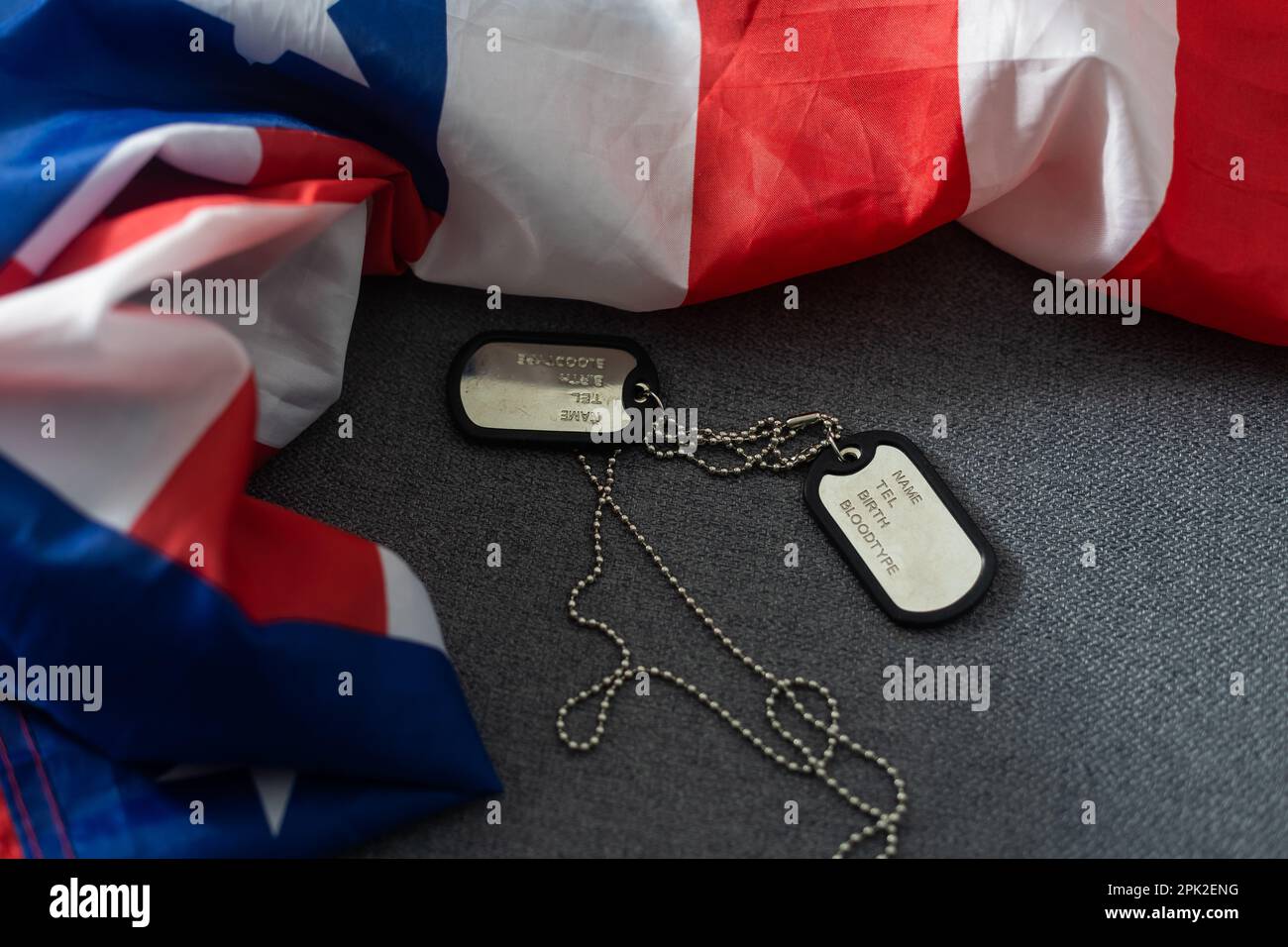 Army tokens on military uniform and USA national flag background Stock ...