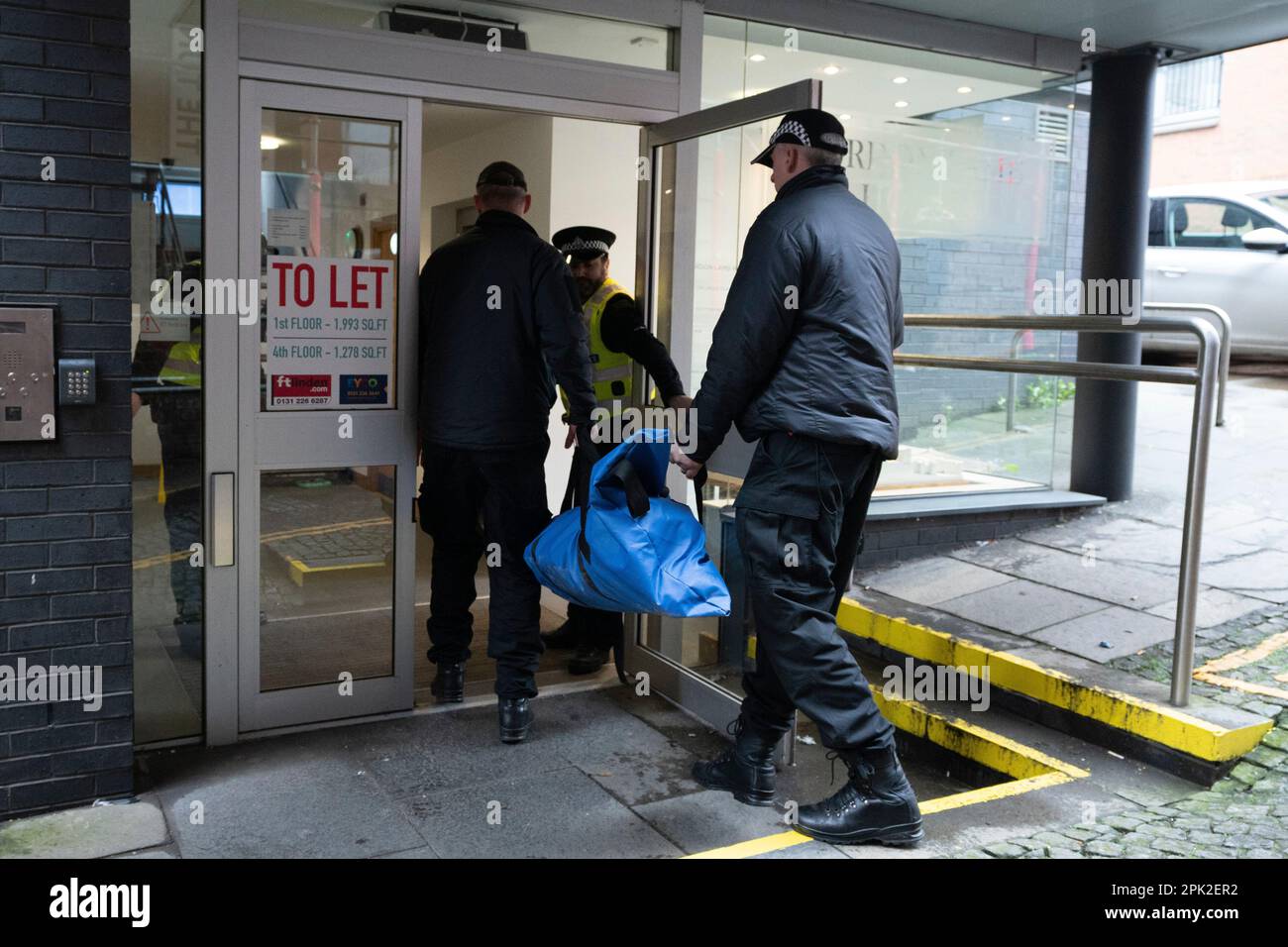 Edinburgh, Scotland, UK. 5 April 2023. Police enter office building ...
