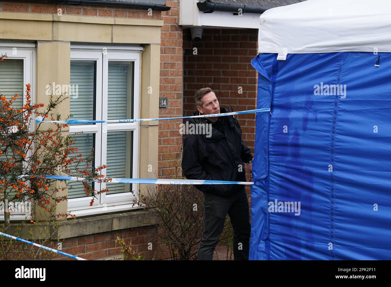 An officer from Police Scotland outside the home of former chief ...