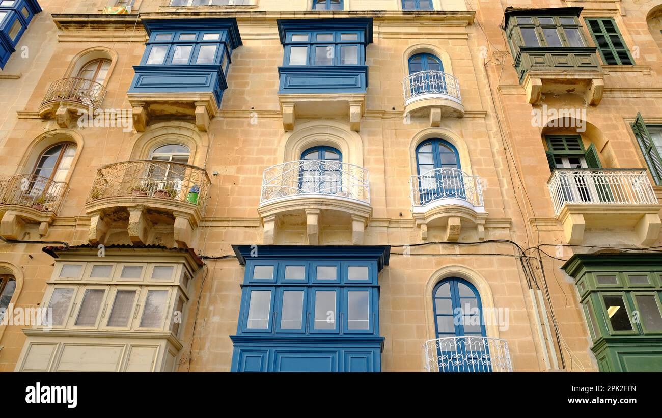 Typical residential houses in Malta with colorful wooden balconies ...