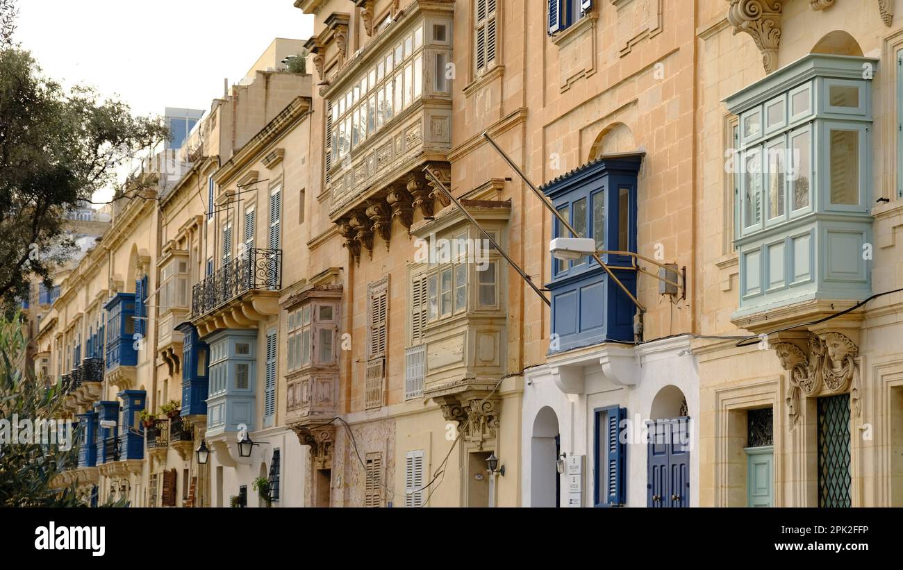 Typical residential houses in Malta with colorful wooden balconies ...