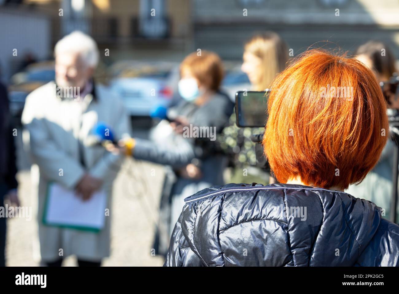 Filming media event or news conference with smartphone. Mobile ...