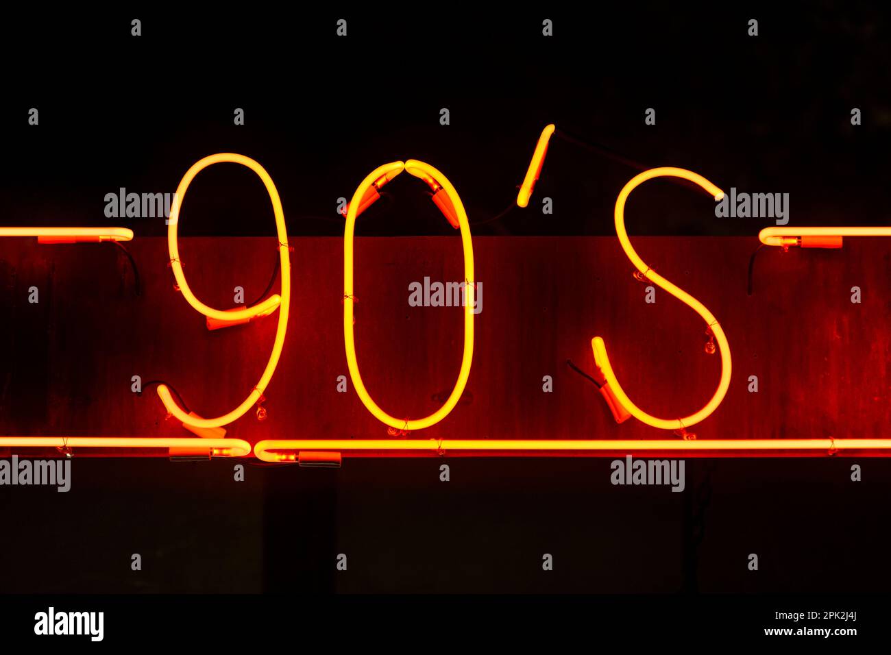 Red neon light above a restaurant saying 90's Stock Photo - Alamy