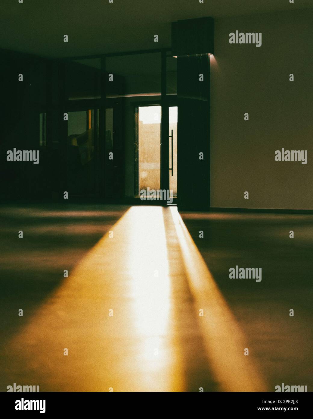 A modern room lit up by a bright white light, positioned in the center ...