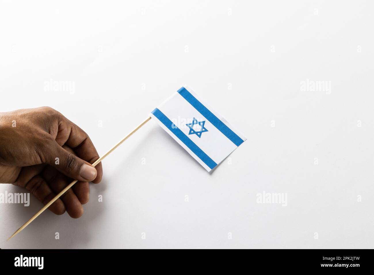 Close up of biracial man holiday flag of israel with copy space on ...