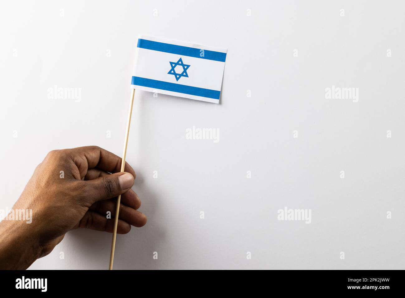 Close up of biracial man holiday flag of israel with copy space on ...