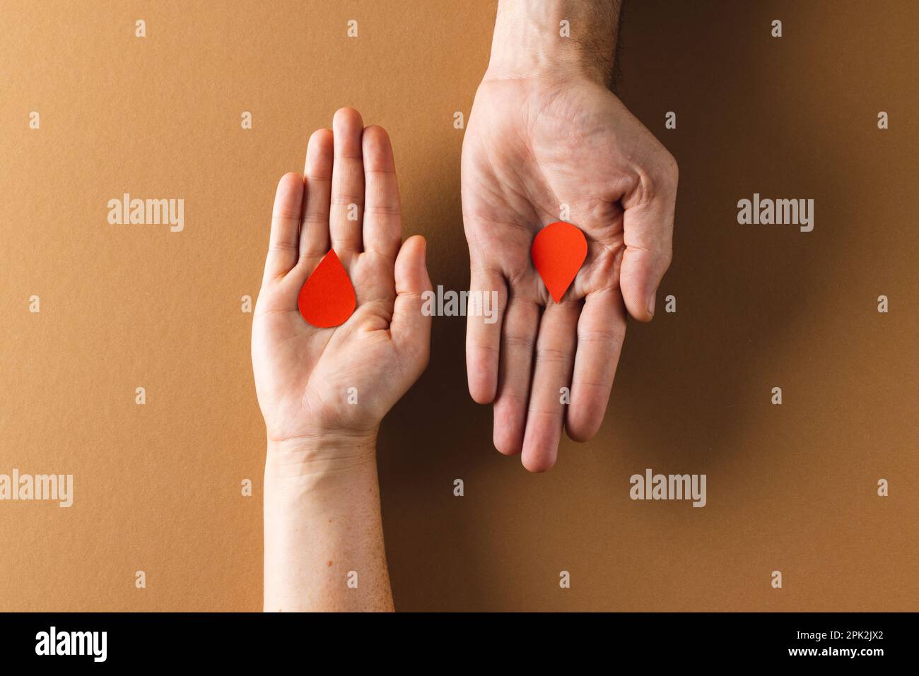 Hands holding blood drop hi-res stock photography and images - Alamy