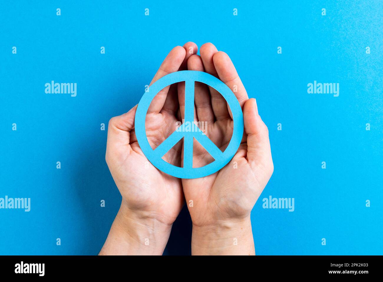 Holding hands peace hi-res stock photography and images - Alamy