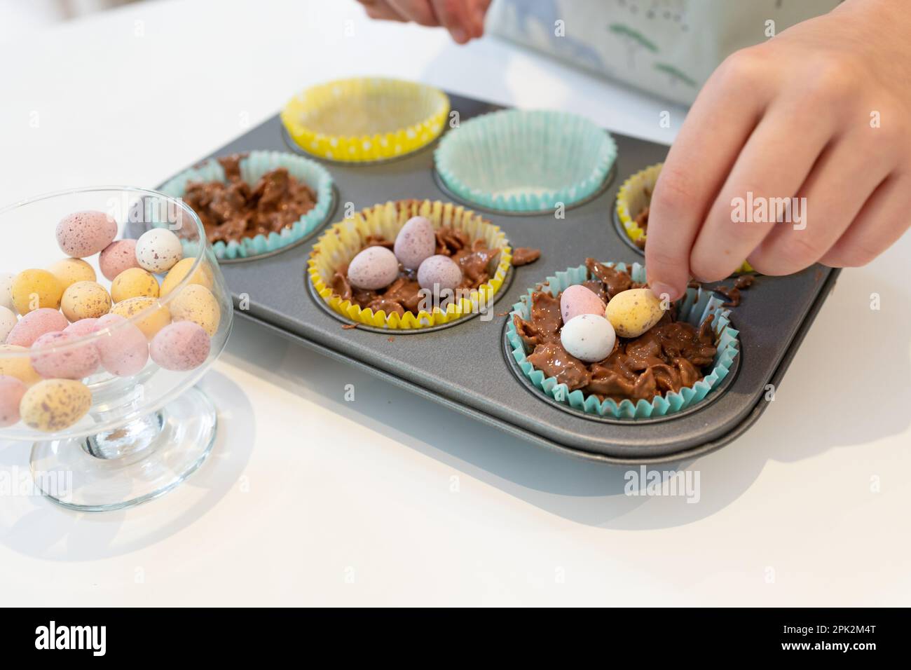 Child making mini egg nests hi-res stock photography and images - Alamy
