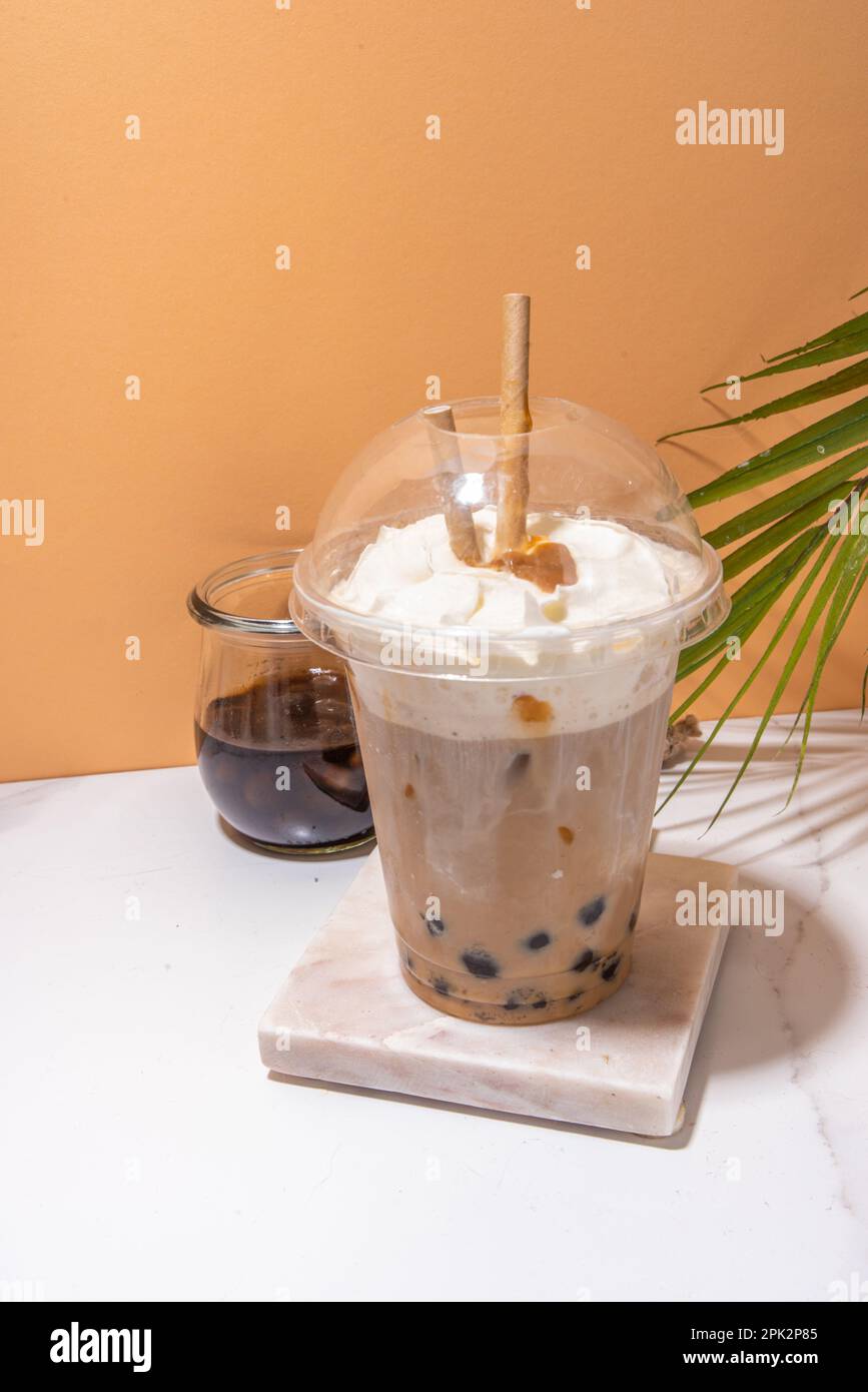 Tapioca boba balls coffee frappe, asian trendy cold coffee drink with ...