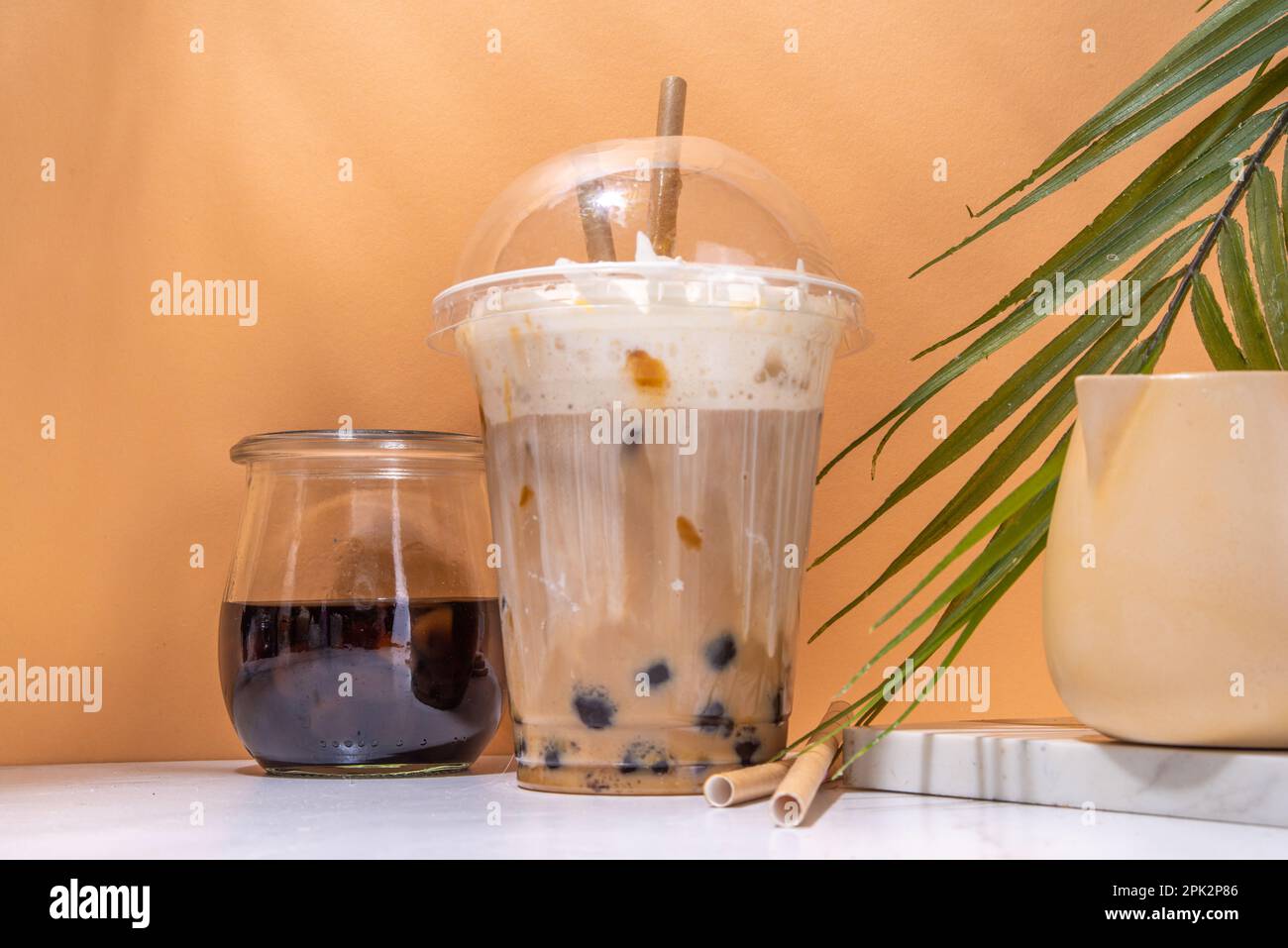 Tapioca boba balls coffee frappe, asian trendy cold coffee drink with ...