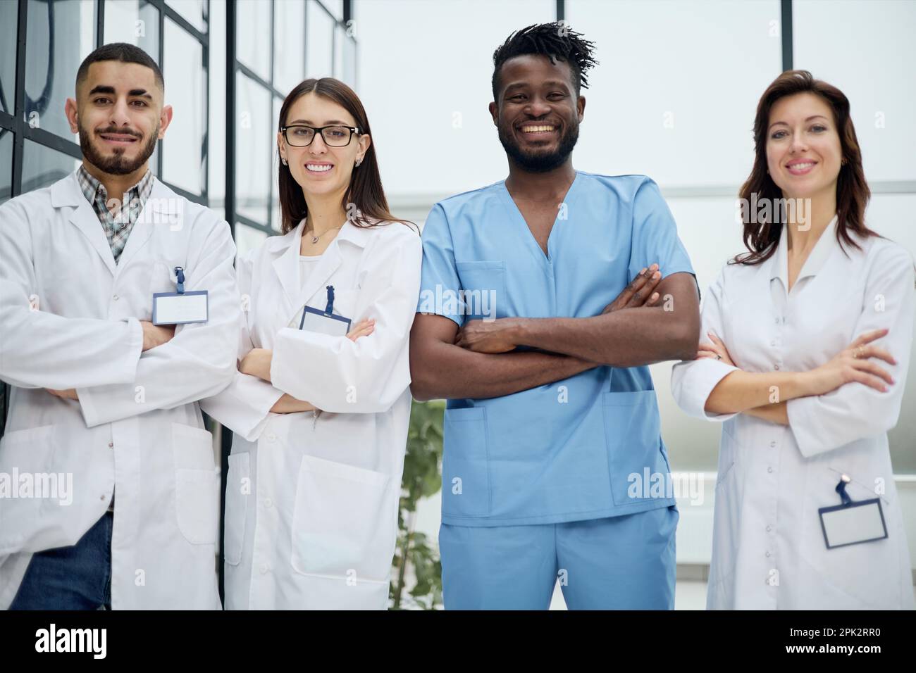Male senior doctor standing in hospital corridor hi-res stock ...
