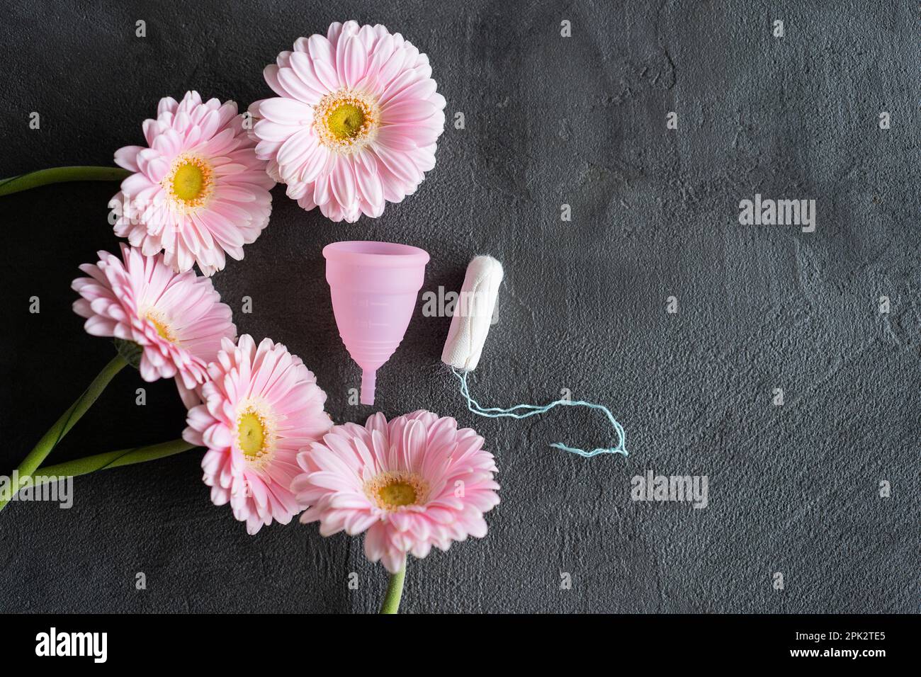 Tampons and menstrual cup on pink background Stock Photo - Alamy