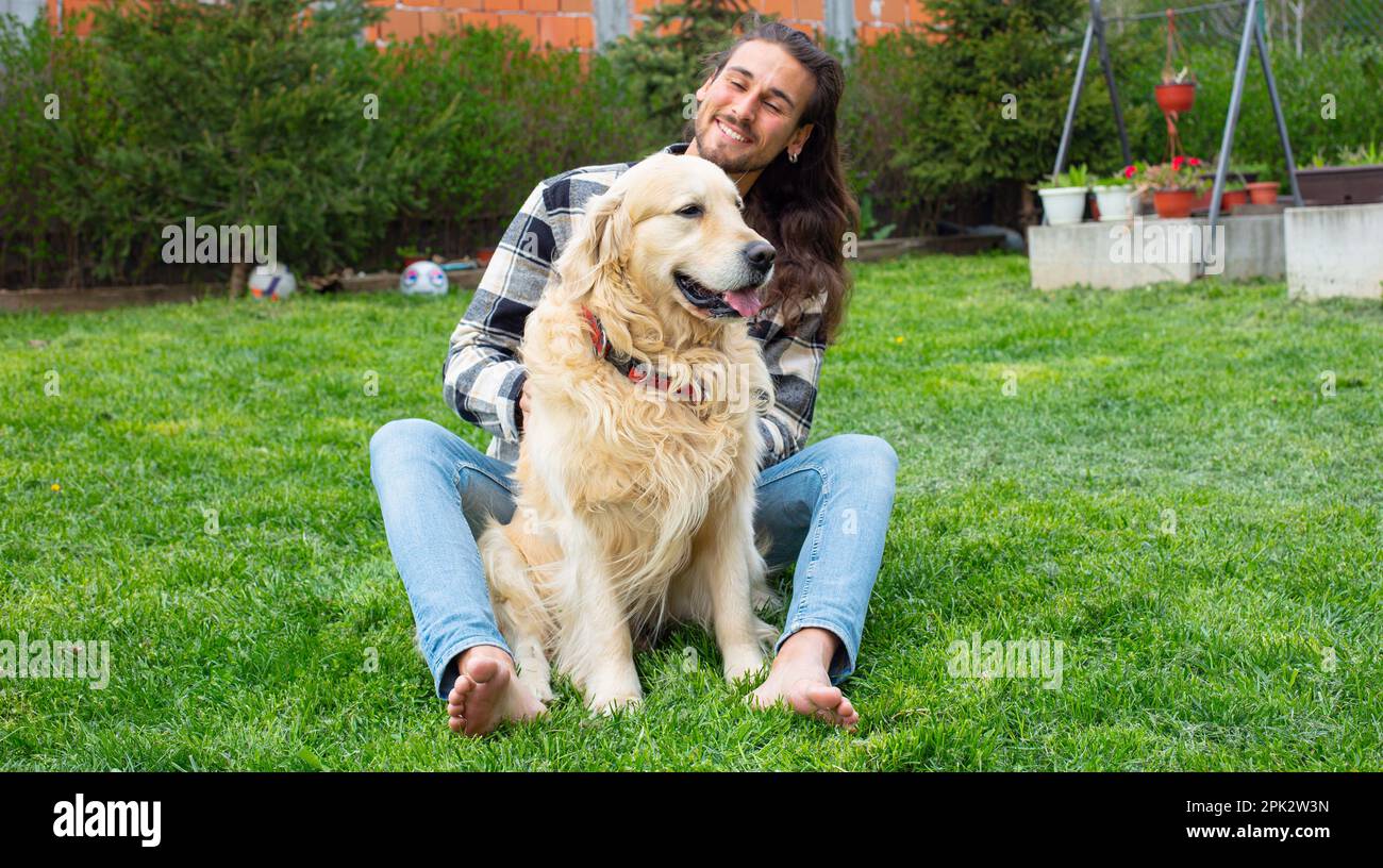 Golden retriever and owner Stock Photo - Alamy