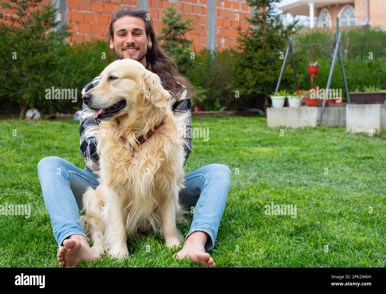 Golden retriever and owner Stock Photo - Alamy