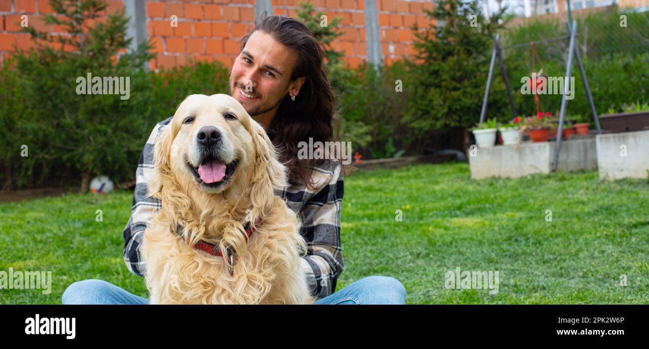 Golden retriever and owner Stock Photo - Alamy