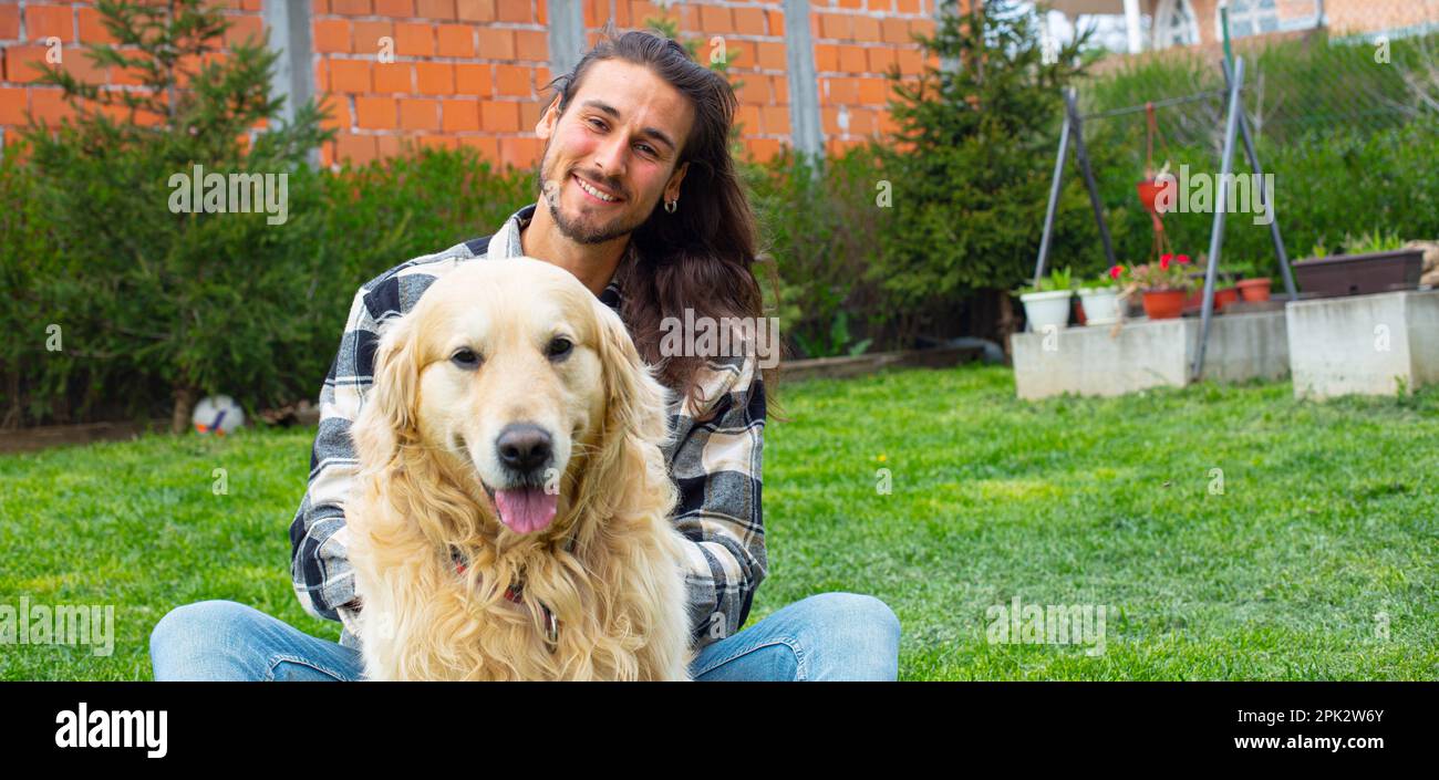 Golden retriever and owner Stock Photo - Alamy