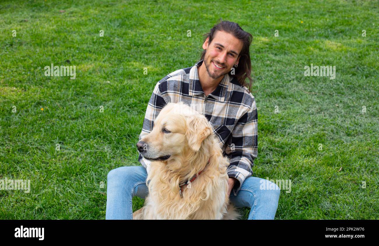 Golden retriever and owner Stock Photo - Alamy