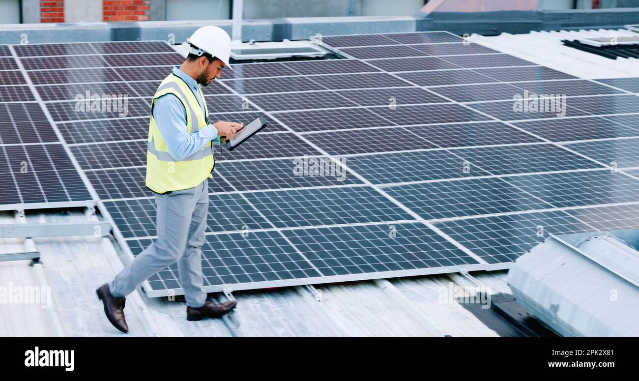 Electrician checking solar panels technology on the roof of the ...