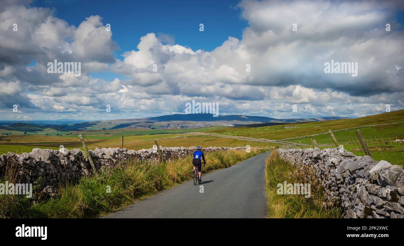 Female road cyclist on the fells above Malham, Yorkshire Dales Stock ...