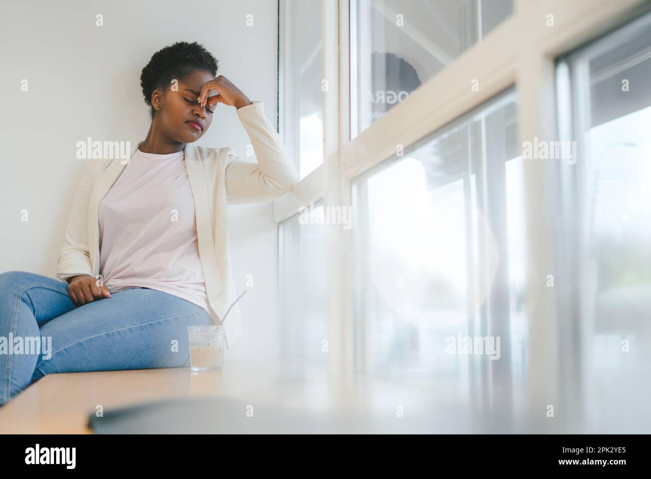Portrait unhappy young business woman, head on window, having bad ...
