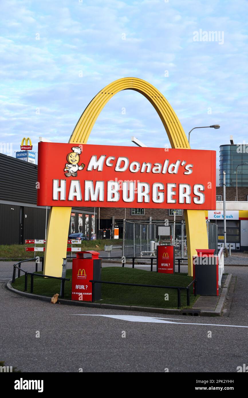 Red McDonald's Hamburgers sign on yellow arch in retro-style; pole with ...