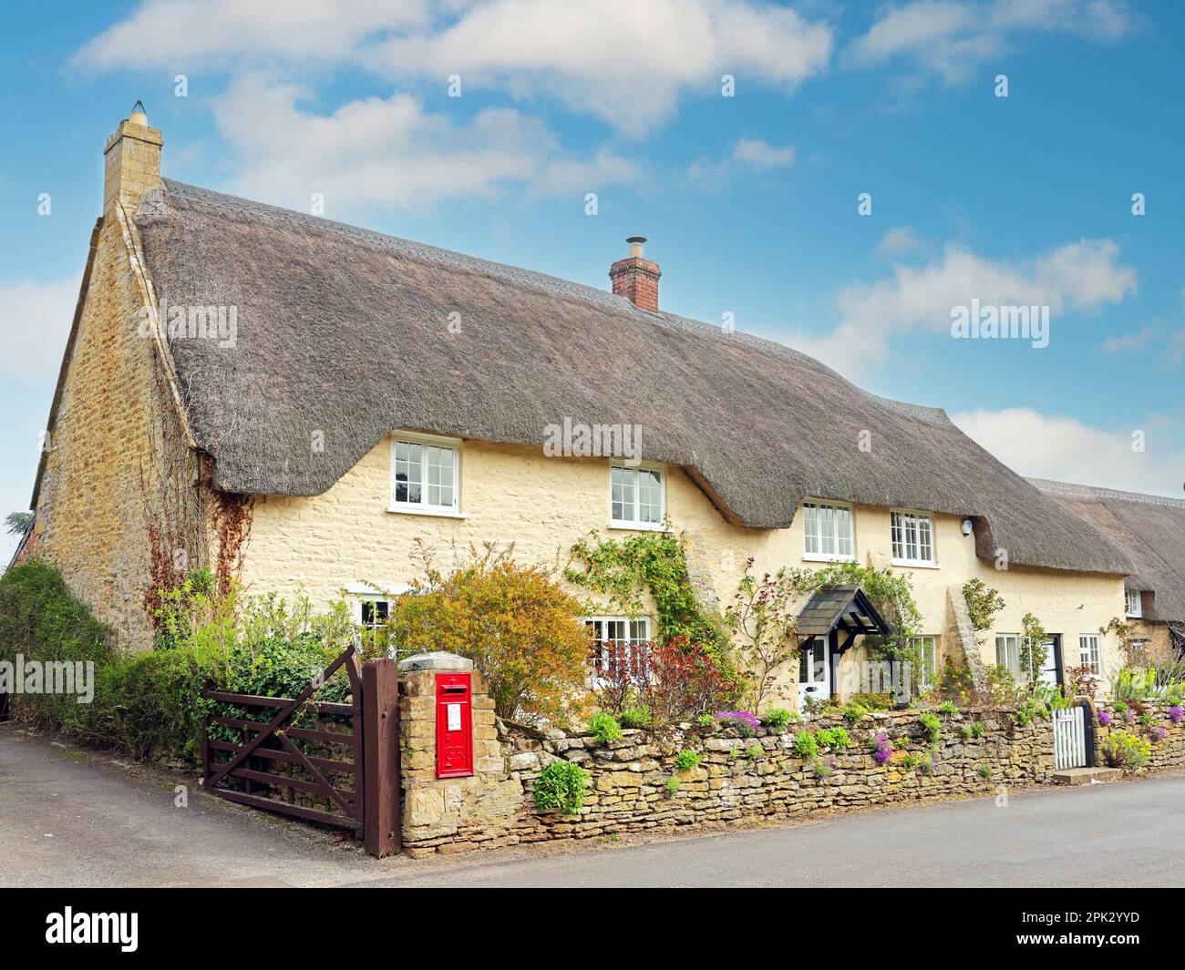 Old Thatched hamstone cottage Stock Photo - Alamy