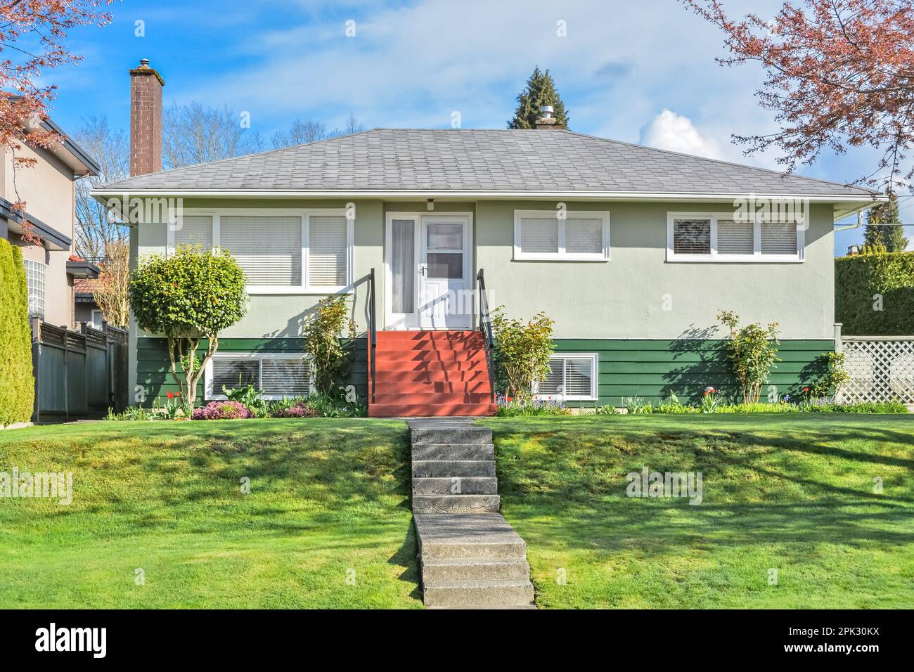 Average residential house on land terrace on blue sky background Stock ...