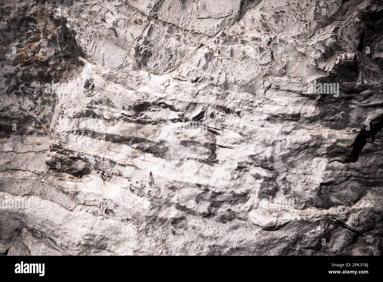 Stone texture of an old rough building wall with cracks, reliefs, plots ...