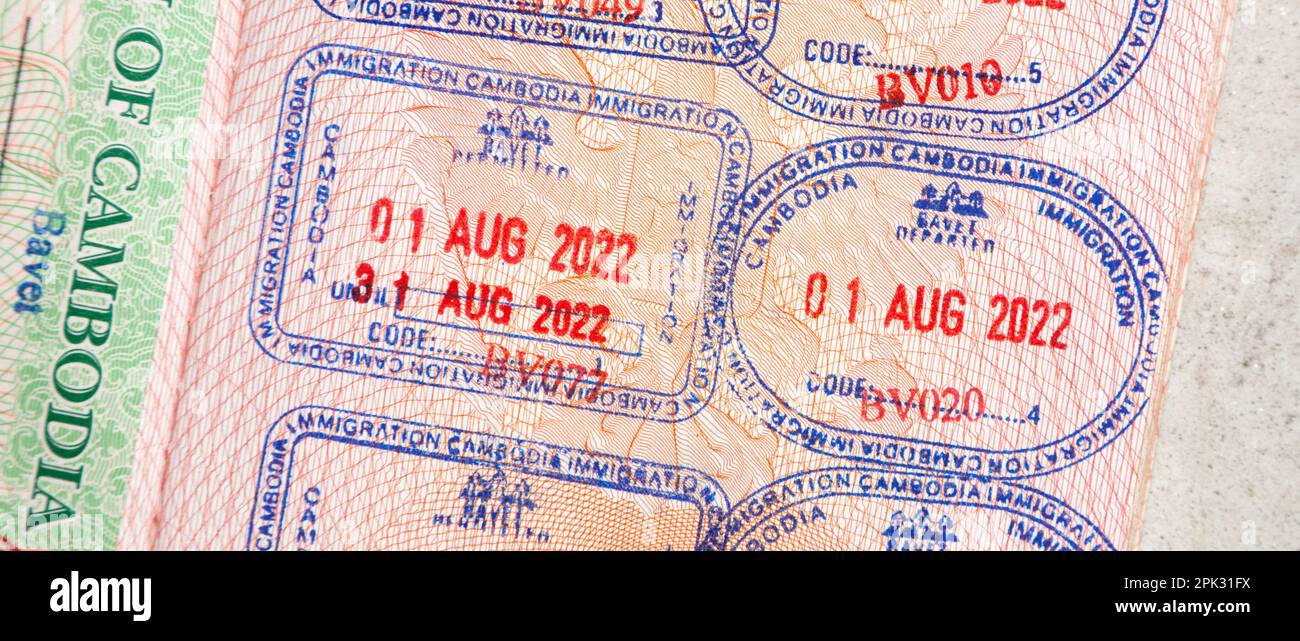 Entry and exit stamps placed in a passport by Cambodia border control ...